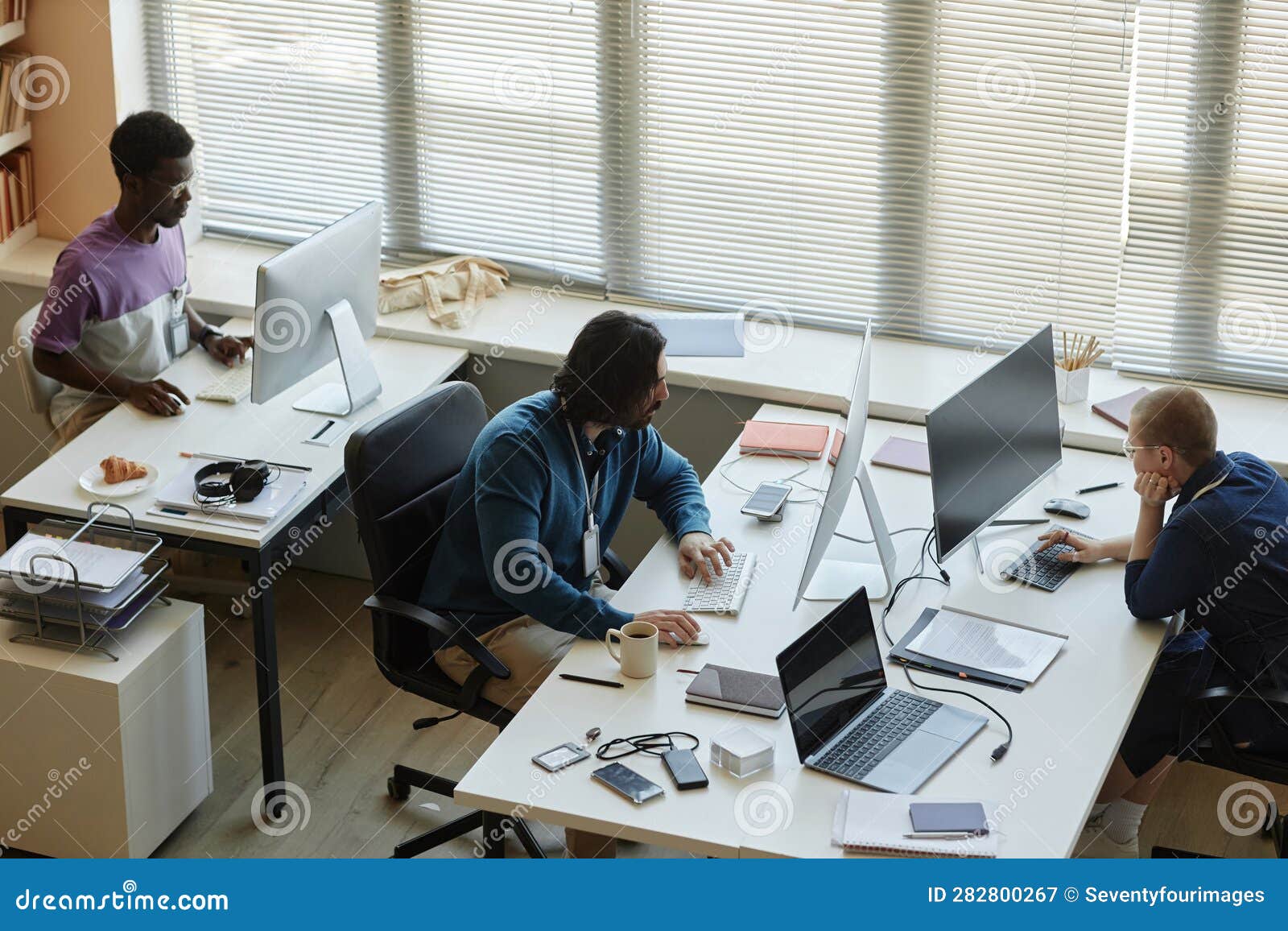 Above Angle of Several Intercultural it Engineers Sitting in Front of ...