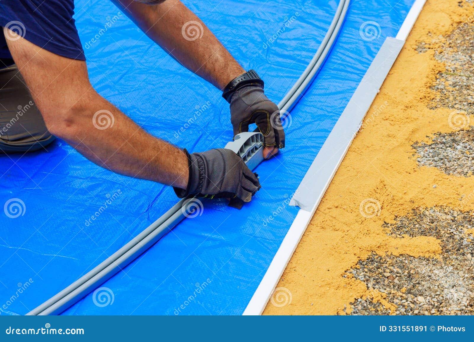 An Above Ground Pool Metal Frame is Being Assembled by a Worker Stock ...