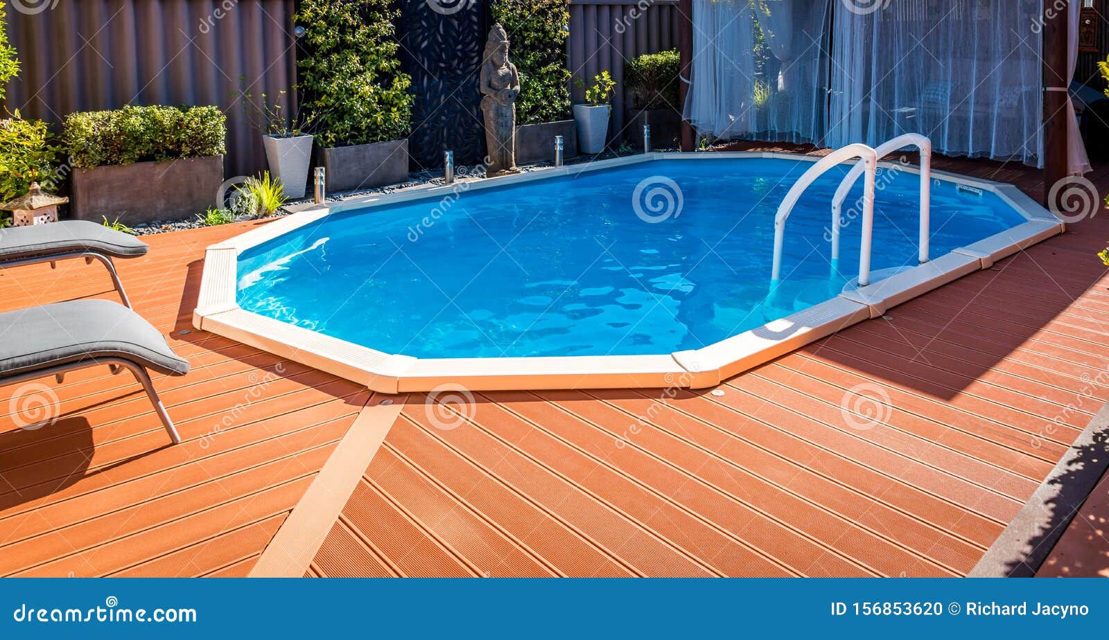 Above Ground Pool Sunken Below Ground and Surrounded by Decking ...