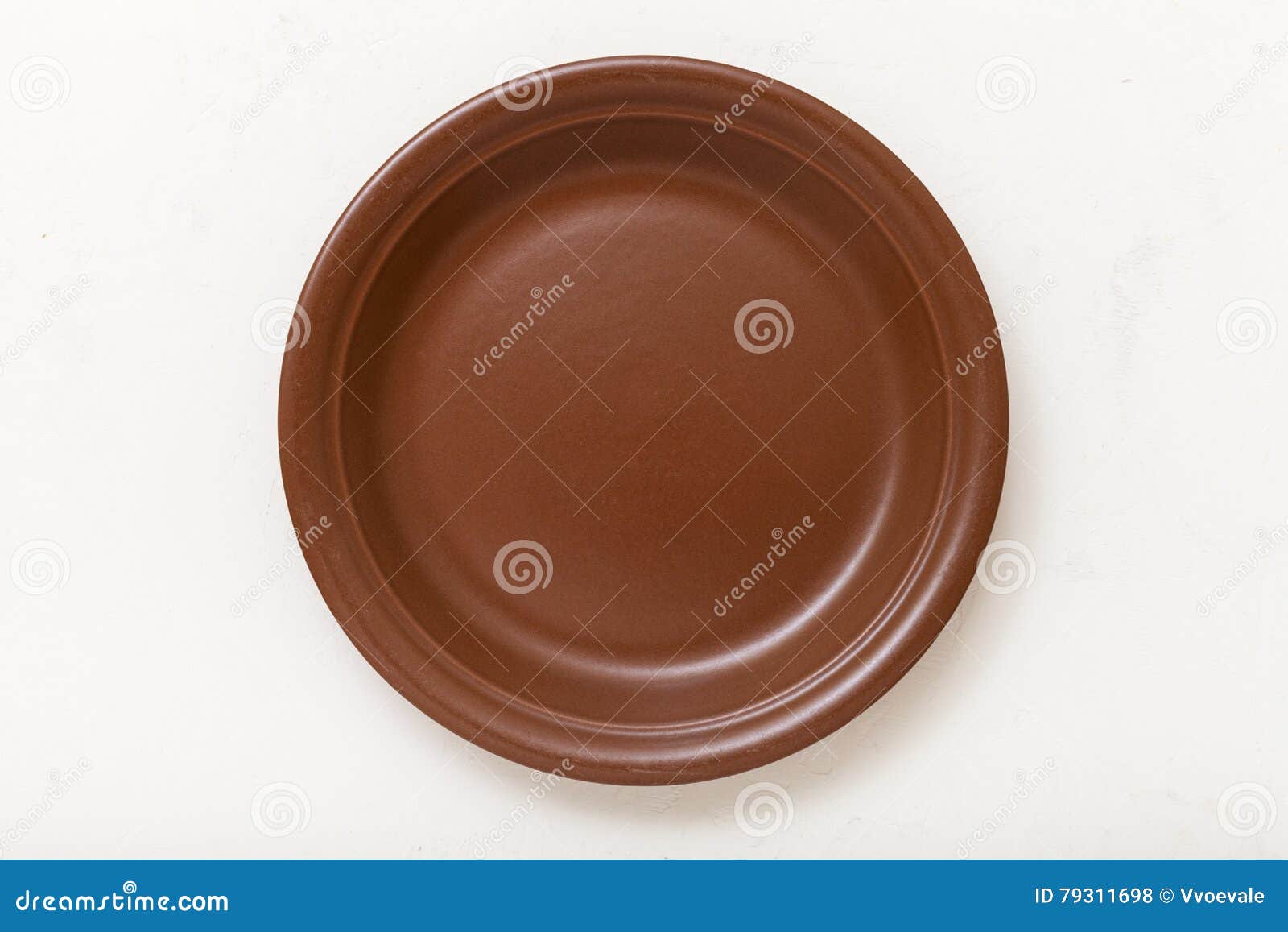 Above View Brown Plate on White Plastering Board Stock Photo - Image of ...