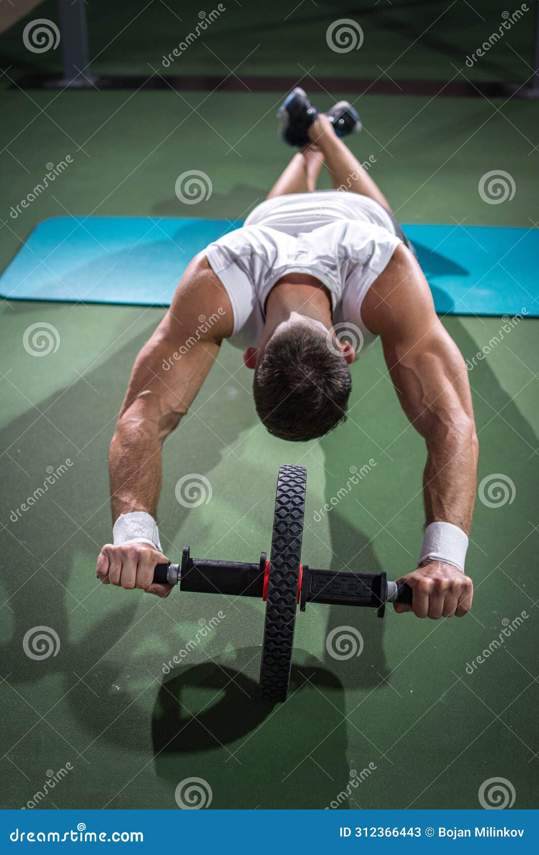 Above View of Muscular Man Doing Exercises with Ab Wheel at Gym Stock ...