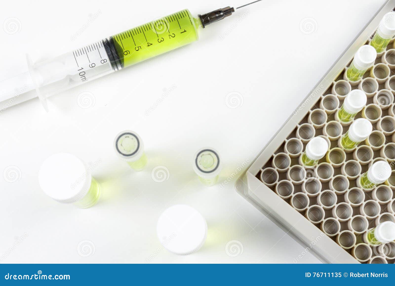 Above View of Syringe and Vials Containing Green Liquid Stock Image ...