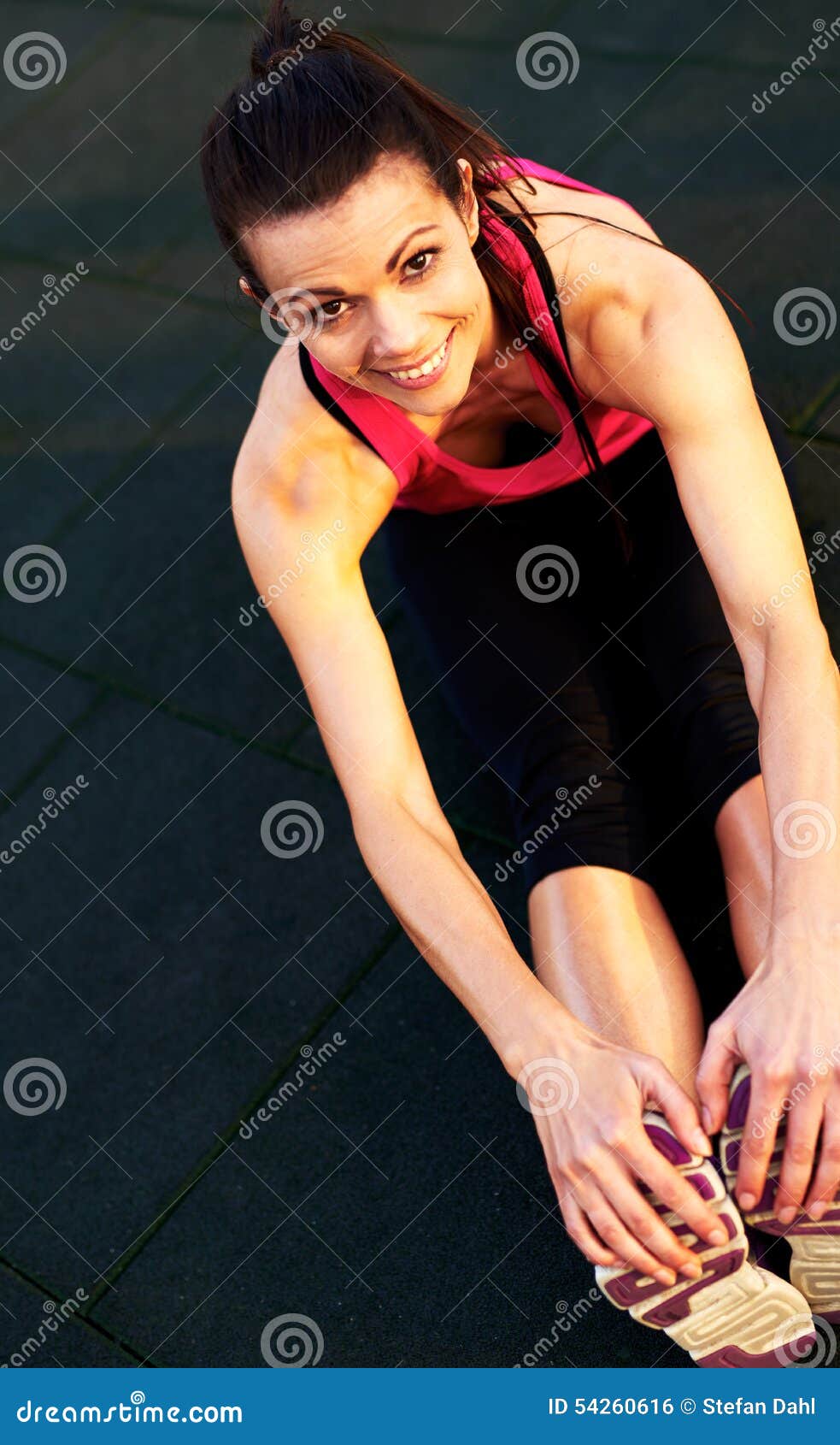 Above View of Woman Stretching Hamstrings on Floor. Stock Photo - Image ...