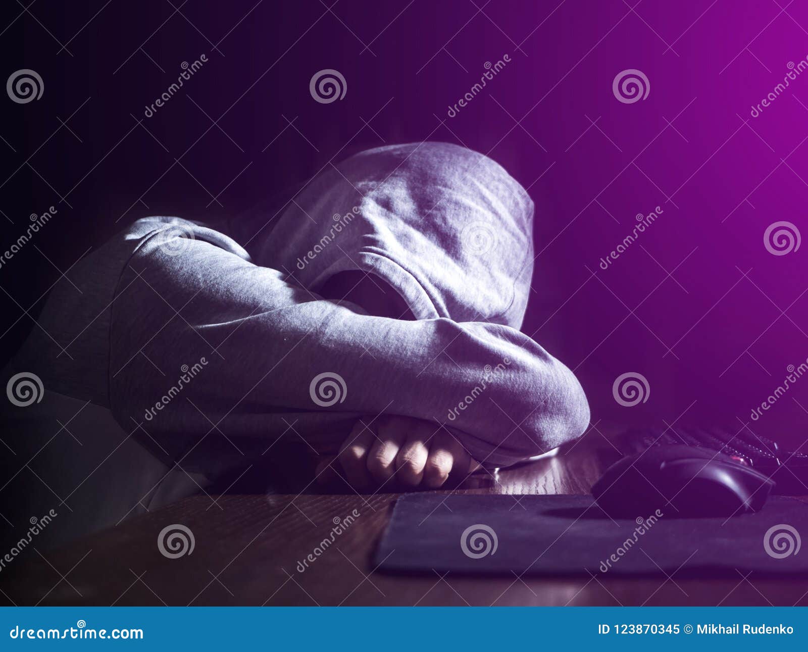 Abstract Anonymous Person in the Hood Sleeping Lying on the Table in ...