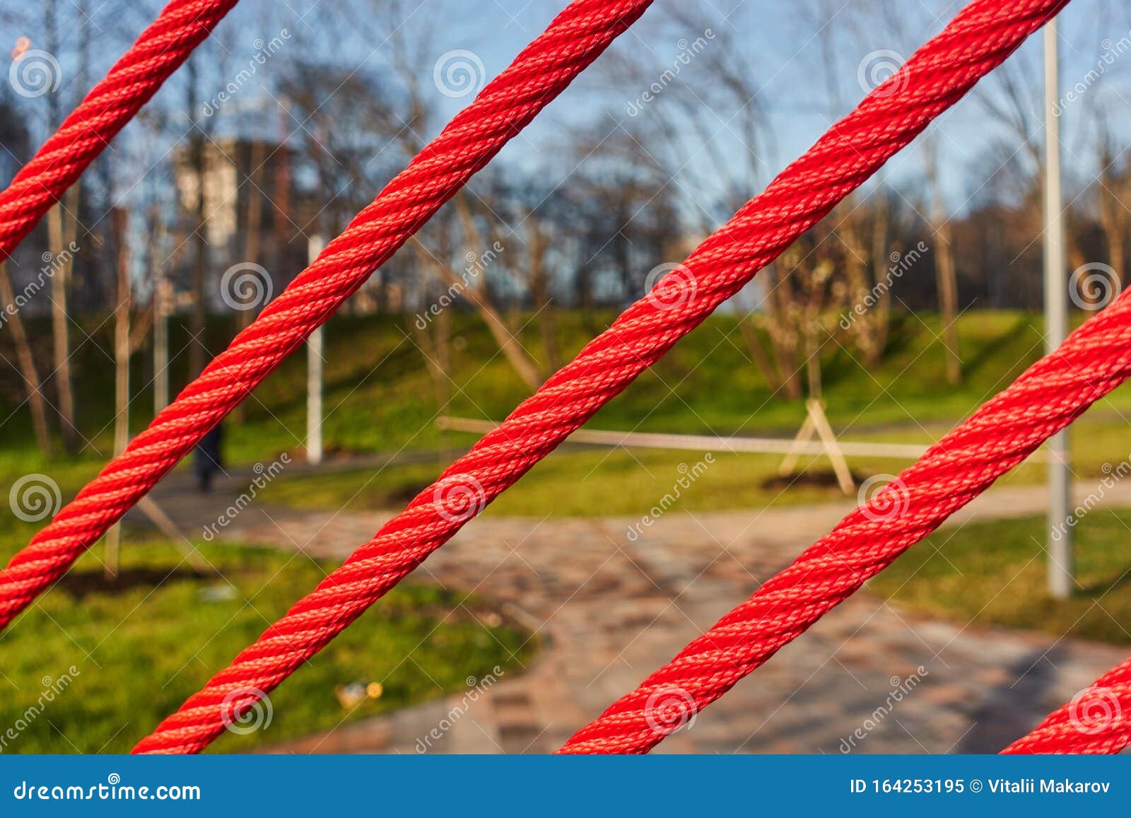 Abstract Architectural Features, Red Ropes with Park in the Background ...