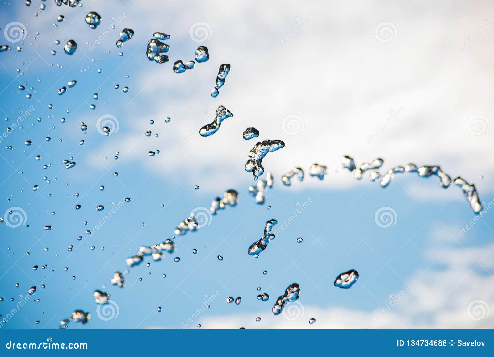 Abstract Background with Flying Drops on a Background of Blue Bright ...
