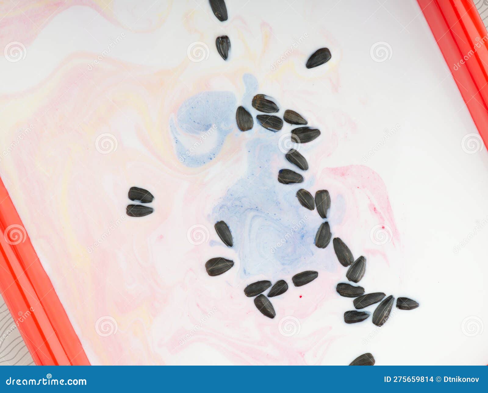 Abstract Background of White Liquid and Small Black Objects Floating in ...