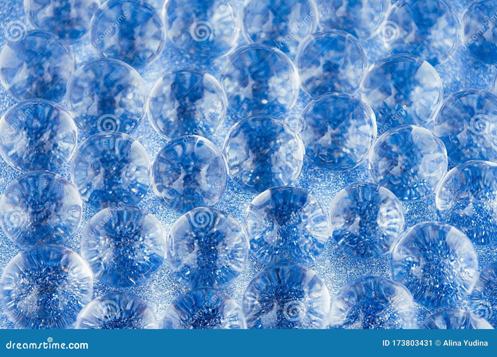 Abstract Blue Background with Transparent Glass Balls on Glitter ...