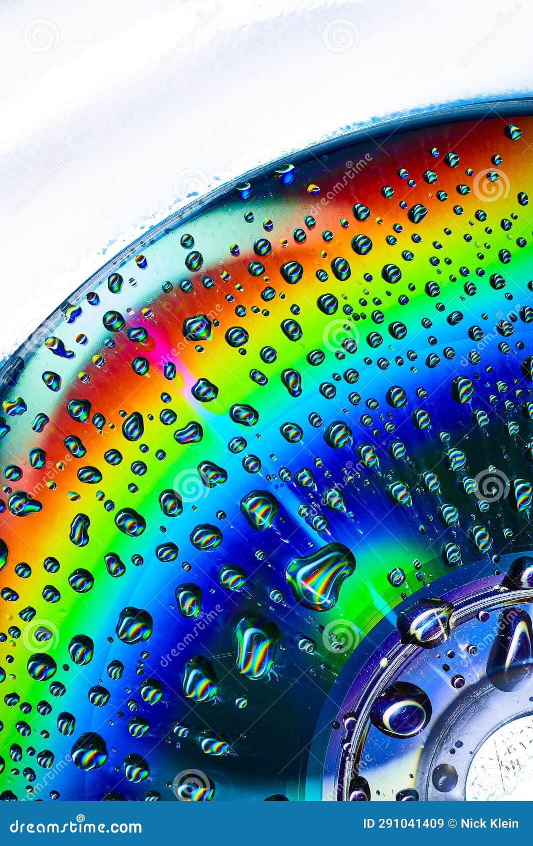 Abstract Close Up of CD with Rainbow Colors on Metallic Surface with ...