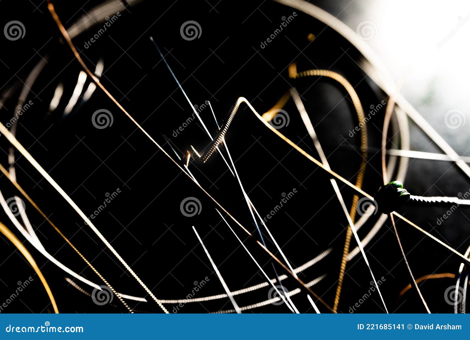 Abstract Closeup of End on Used Bronze Acoustic Guitar String in Front ...