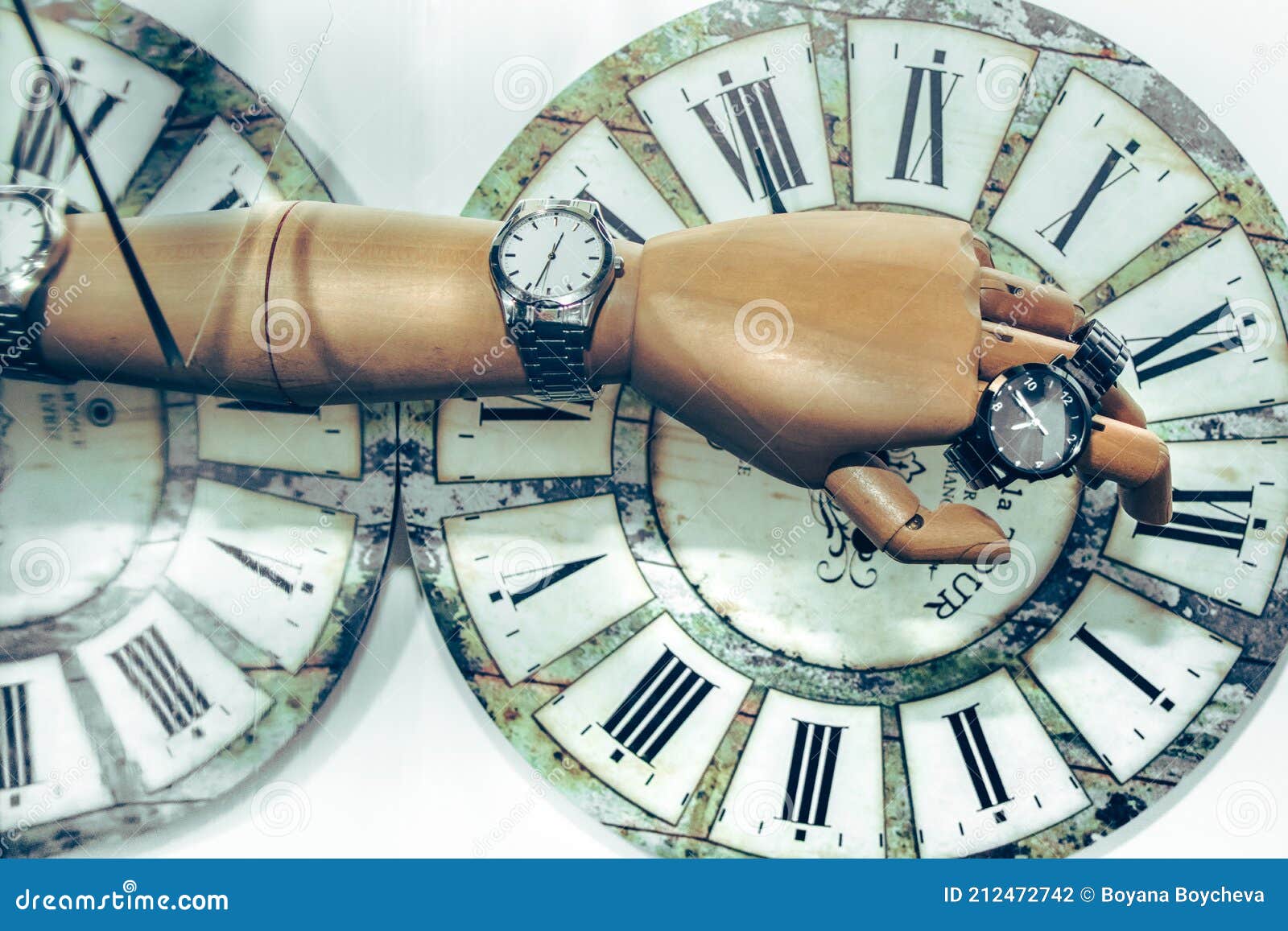 Clocks and a Wooden Hand Reflecting the Time Stock Photo - Image of ...