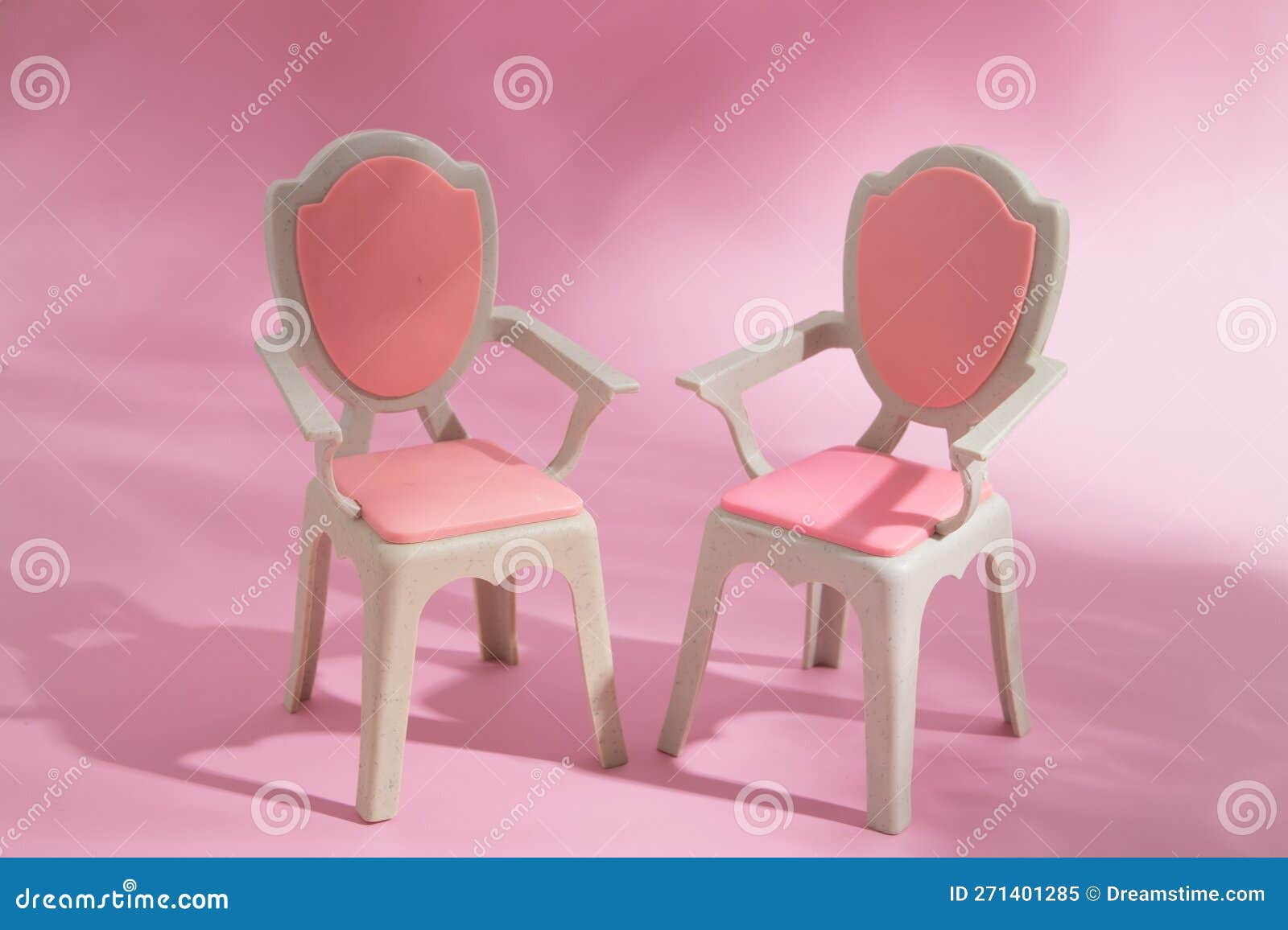 Abstract Composition Still Life Puppet Chairs on a Pink Background with ...