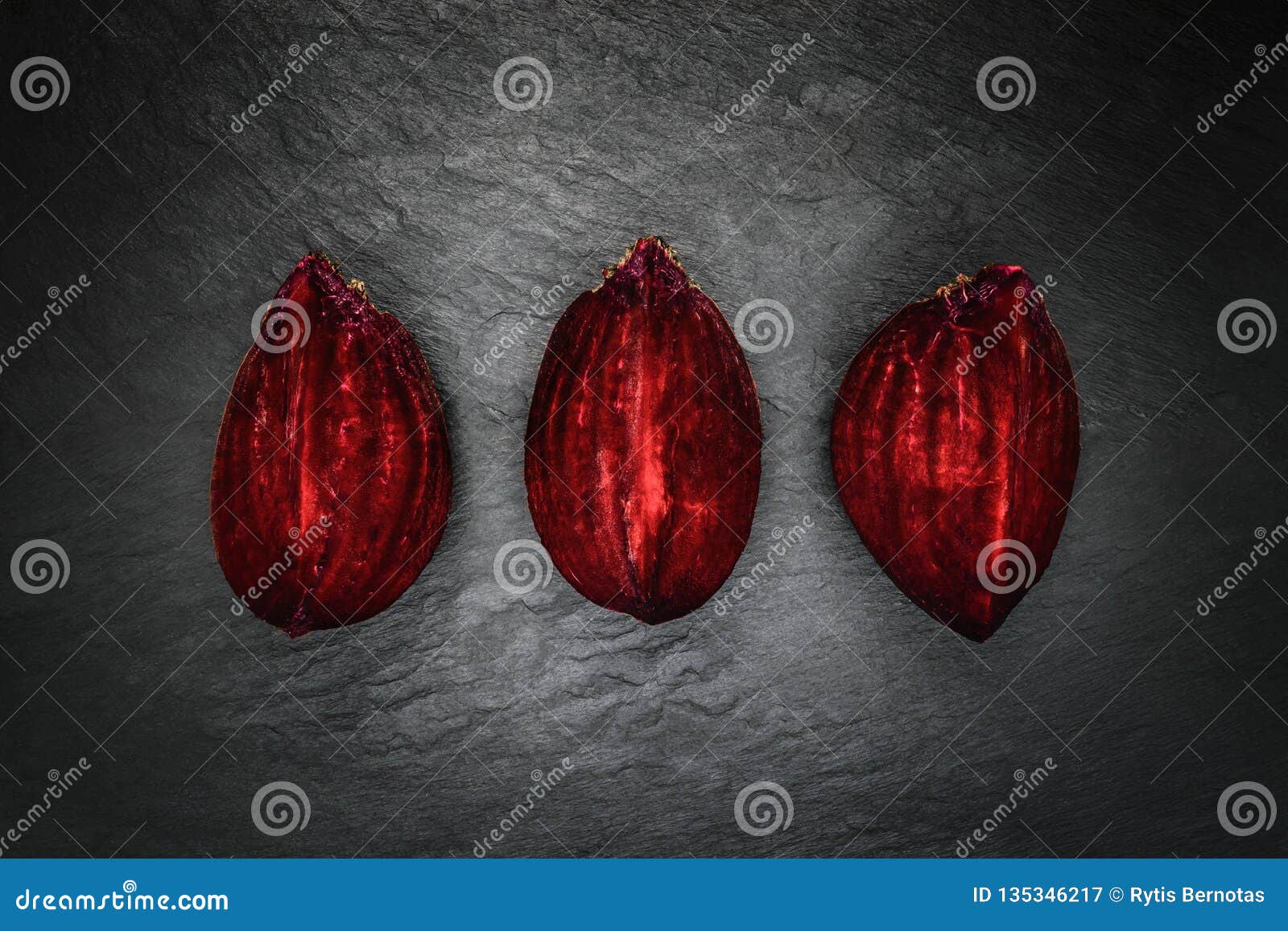 Abstract Composition of Three Pieces Beetroot Placed in Line on Black ...