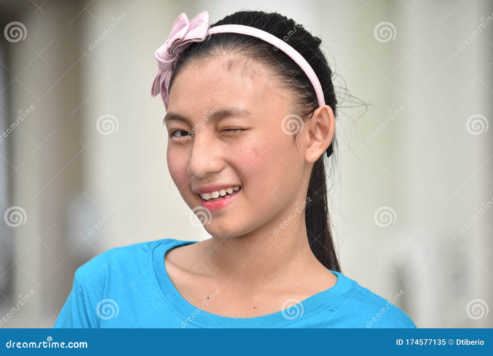 A Winking Diverse Girl stock image. Image of wink, diversity - 174577135