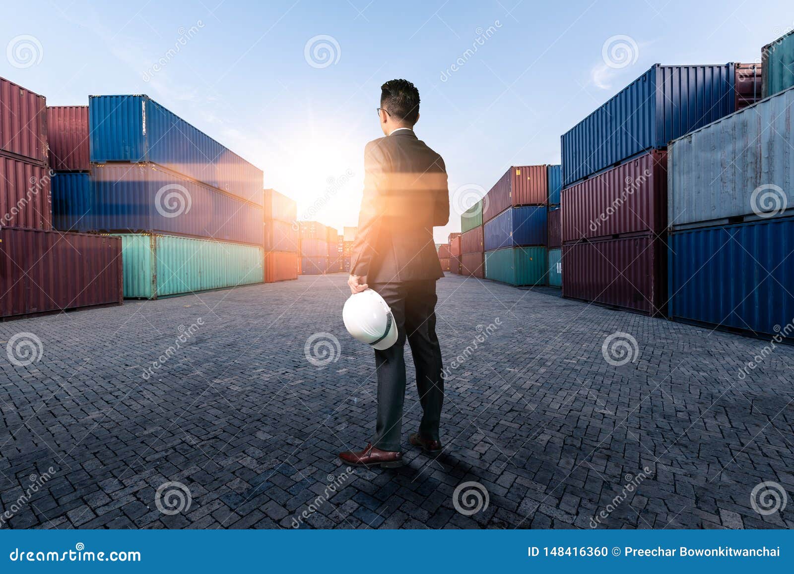 The Abstract Image of Engineer Standing in the Container Yard during ...