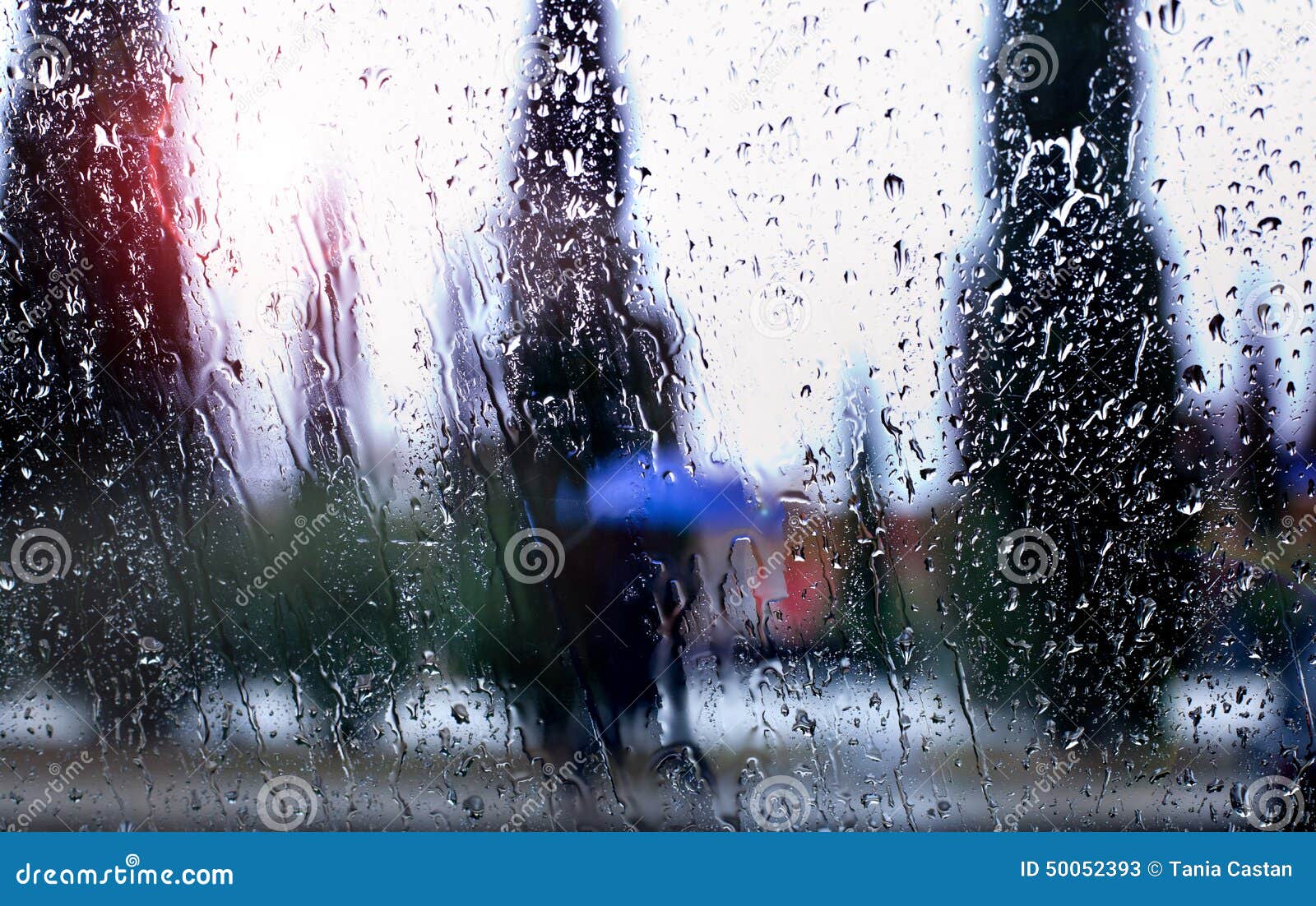 Abstract Image of Falling Rain Drops through the Window with City ...