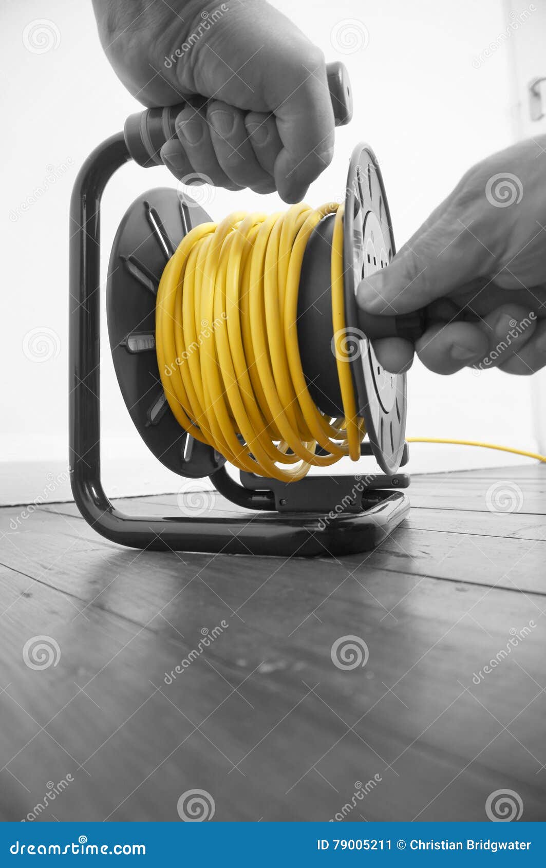 Abstract Image of a Man Winding an Extension Cable Stock Image - Image ...