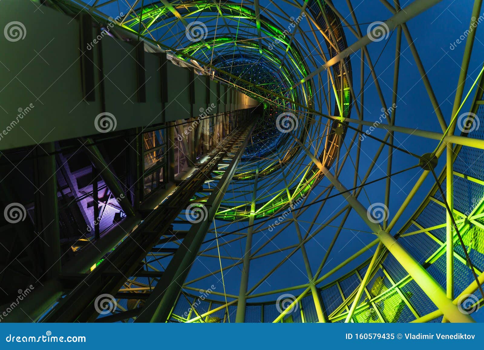 Abstract Metal Tower Design with Green Neon Light Bottom View Stock ...