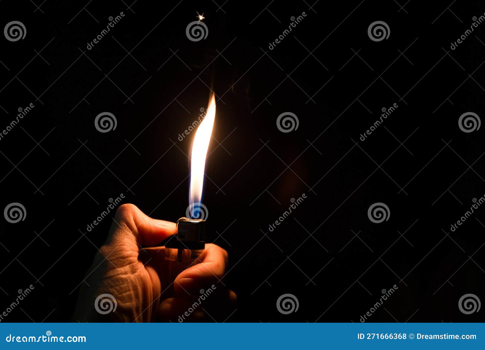 Abstract Motion Hand with Lighter Igniting Sparks on Dark Background ...