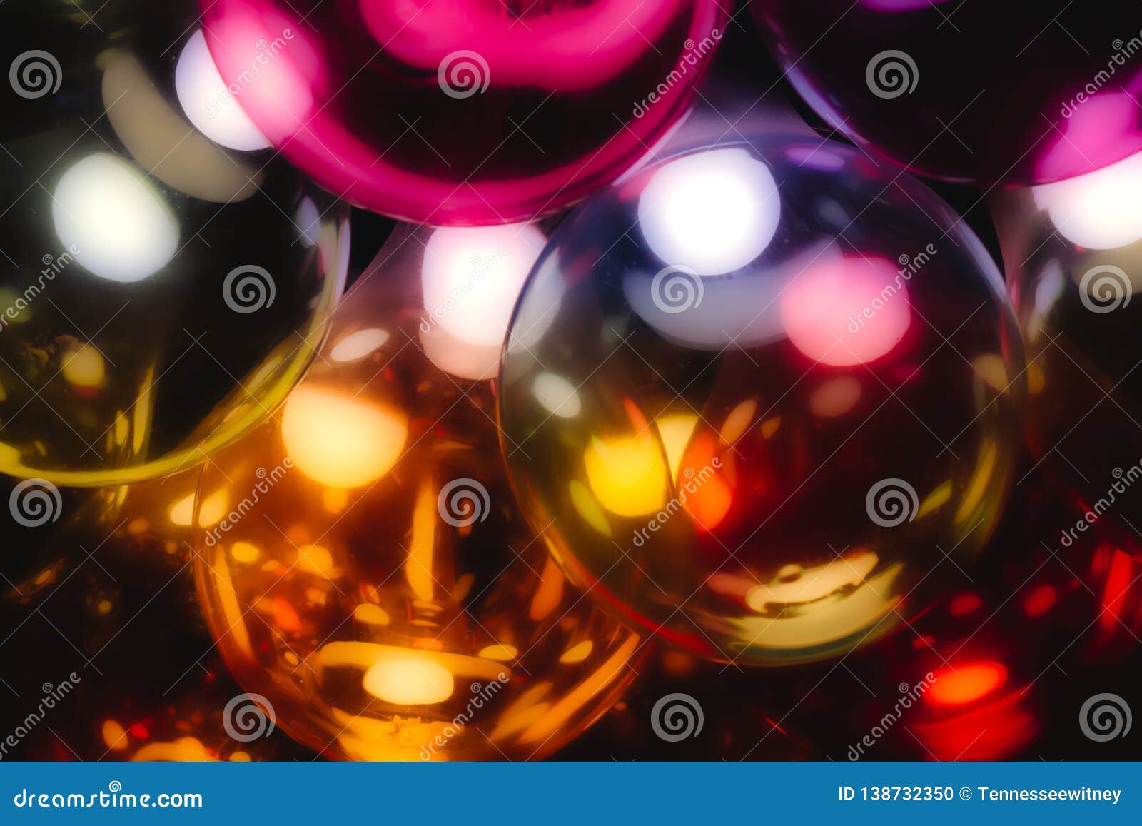 Abstract Multi-colored Glass Light Bulbs with a Warm Glow Stock Photo ...