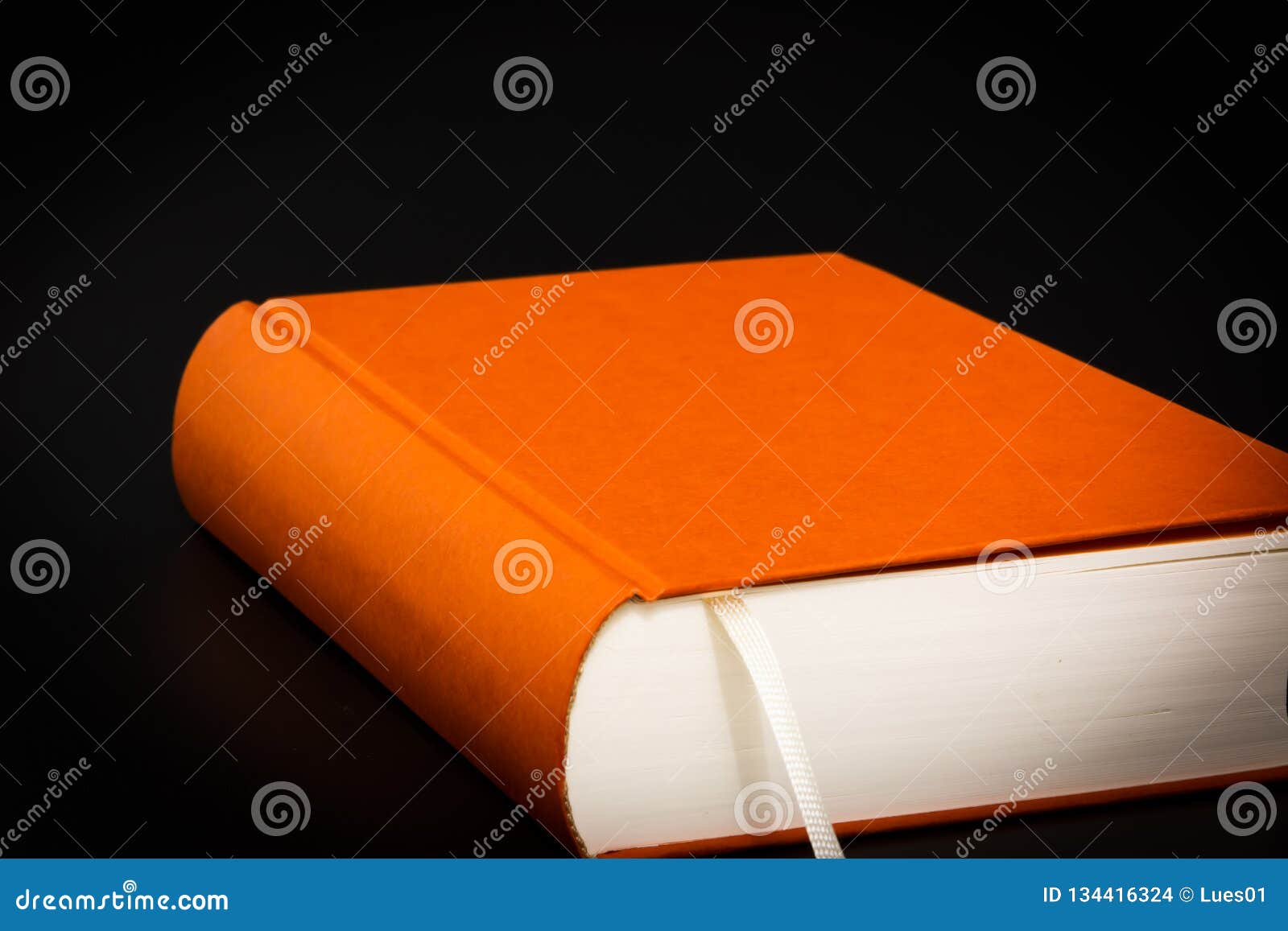 Abstract Orange Colored Book on a Black Background Stock Photo - Image ...