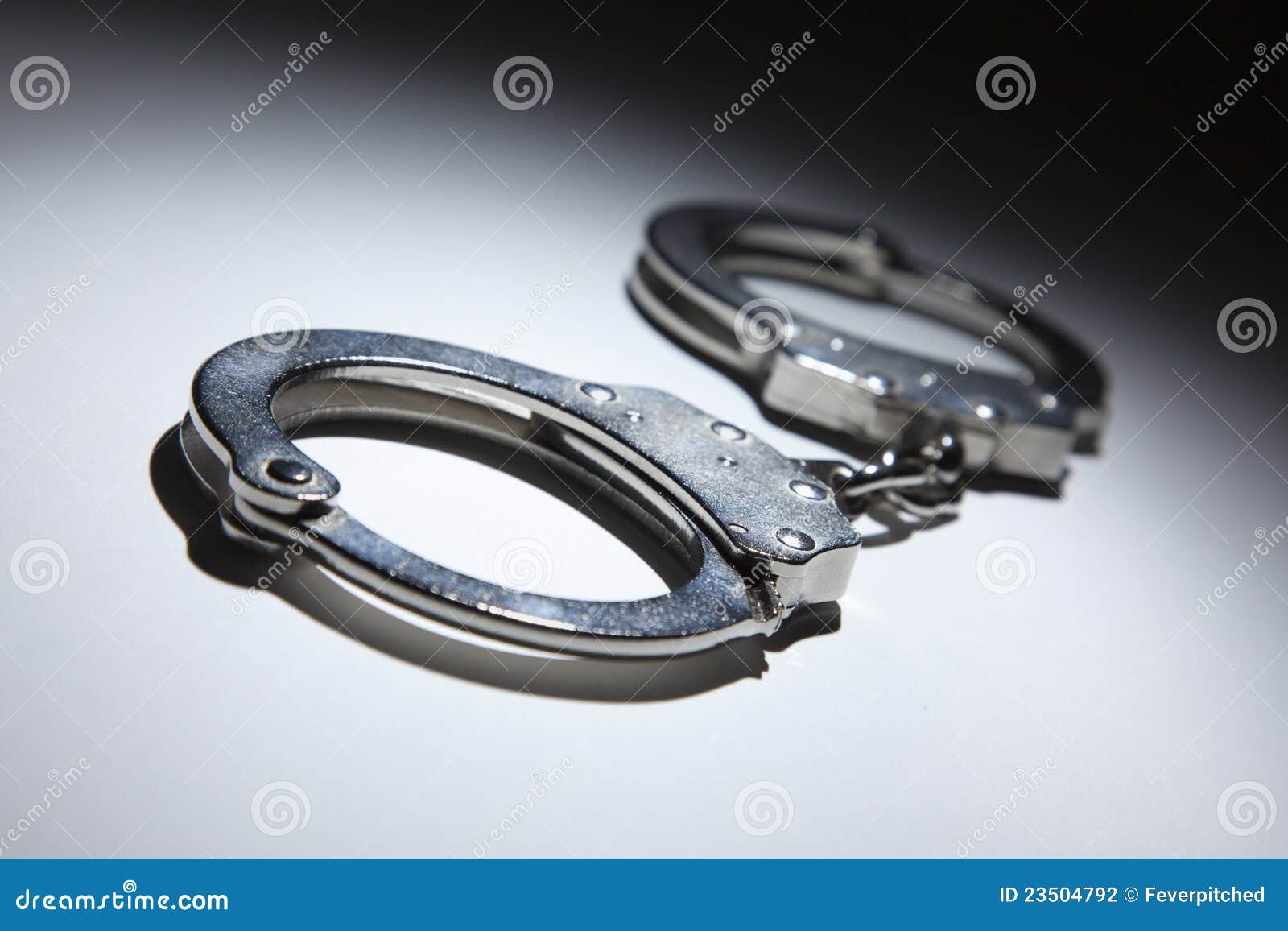 Abstract Pair of Handcuffs Under Spot Light Stock Photo - Image of ...