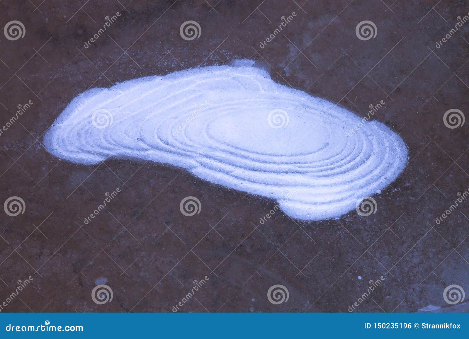 Abstract Pattern of Ice on the Over of Puddle. Toned Stock Photo ...