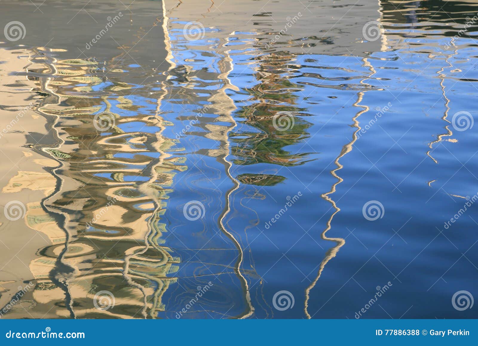 Abstract Reflections of Boats and Buildings in Blue Rippled Water Stock ...
