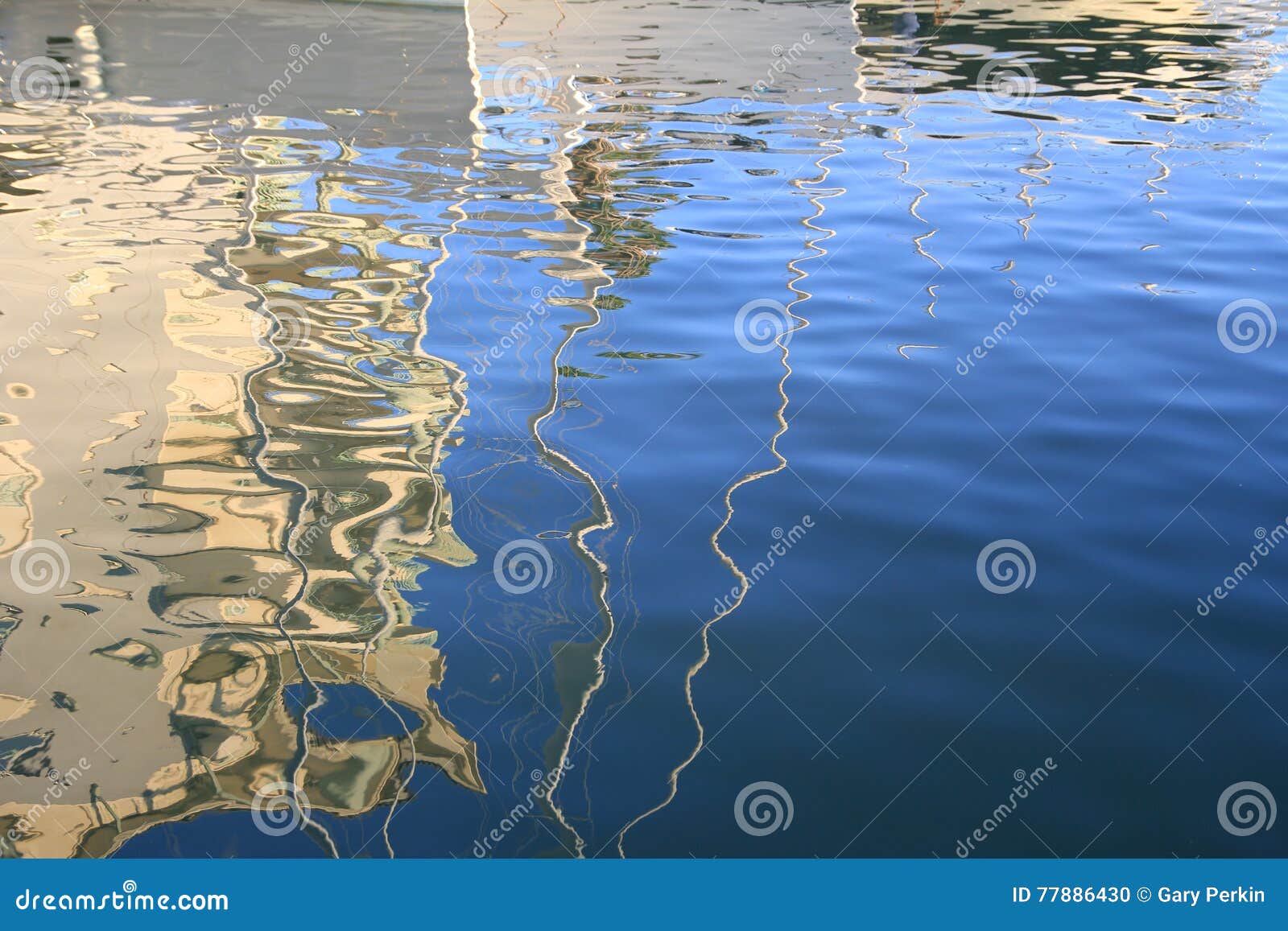 Abstract Reflections of Boats and Buildings in Blue Rippled Water Stock ...