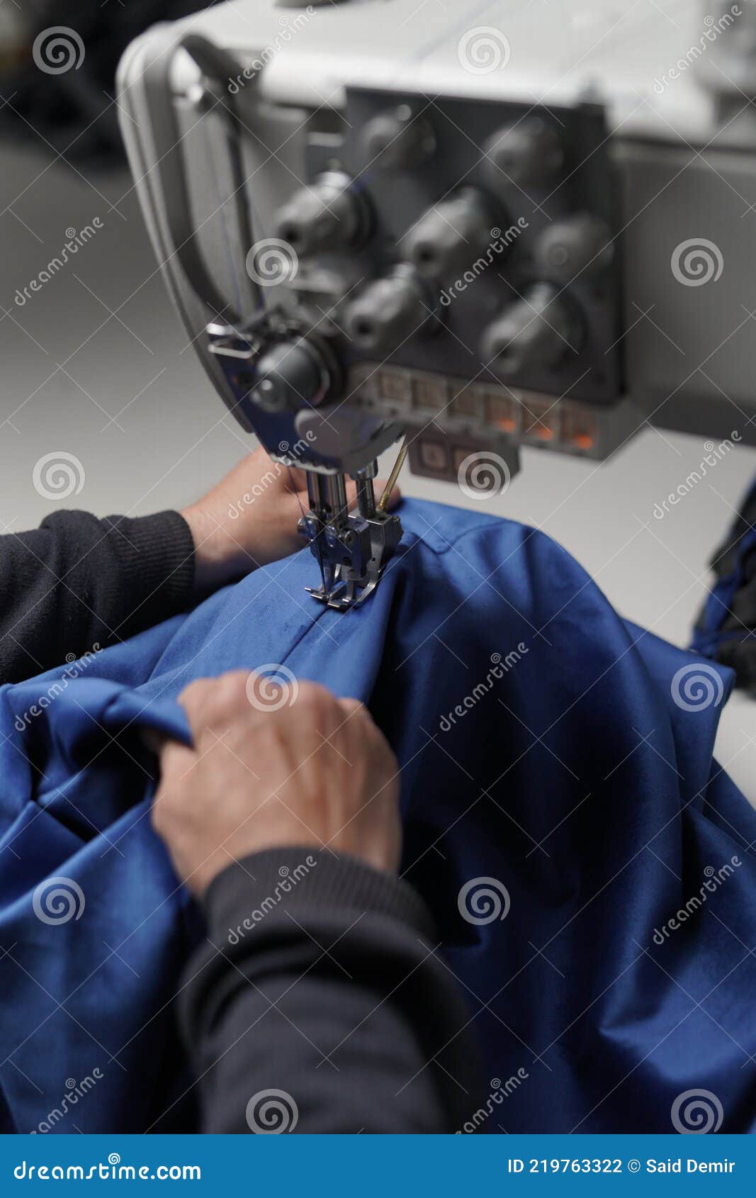 Abstract Shot of Man Sewing Blue Cloth Stock Photo - Image of machine ...
