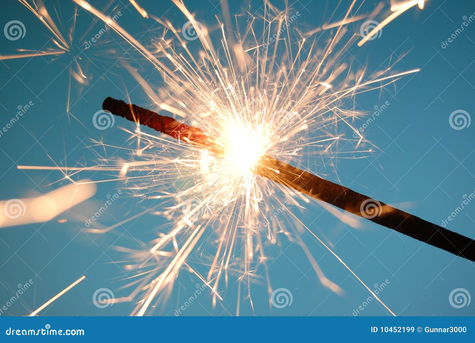 Sparkler On A Red Background. Short Shutter Speed. Small Sparks Scatter ...
