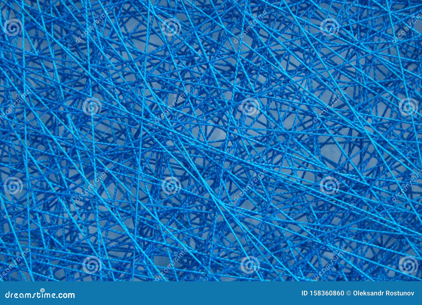 Abstract Weave from a Thin Cord of Blue Color. Background Stock Photo ...