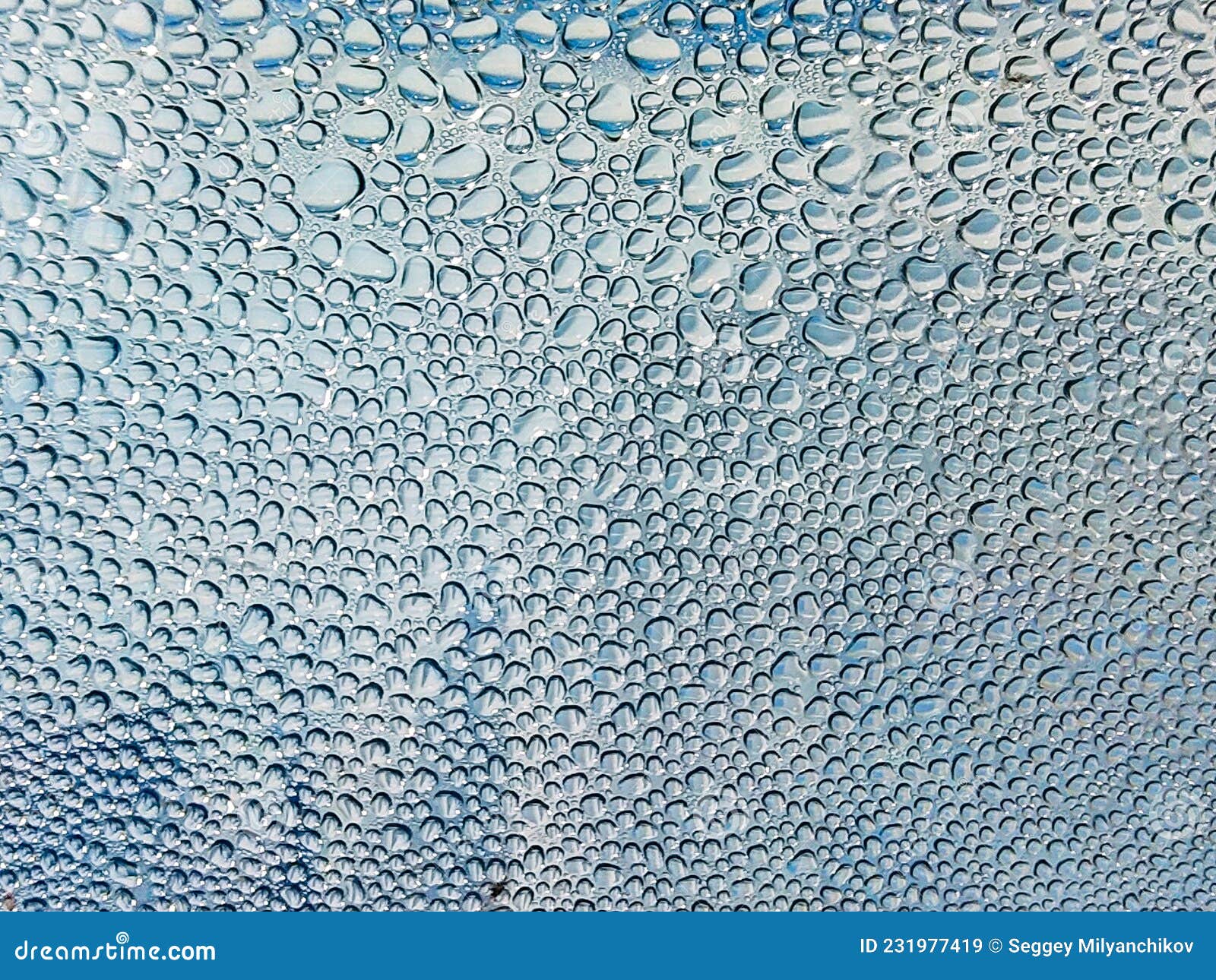 An Abstraction. Drops of Water, Dew, on the Blue Glass Stock Image ...