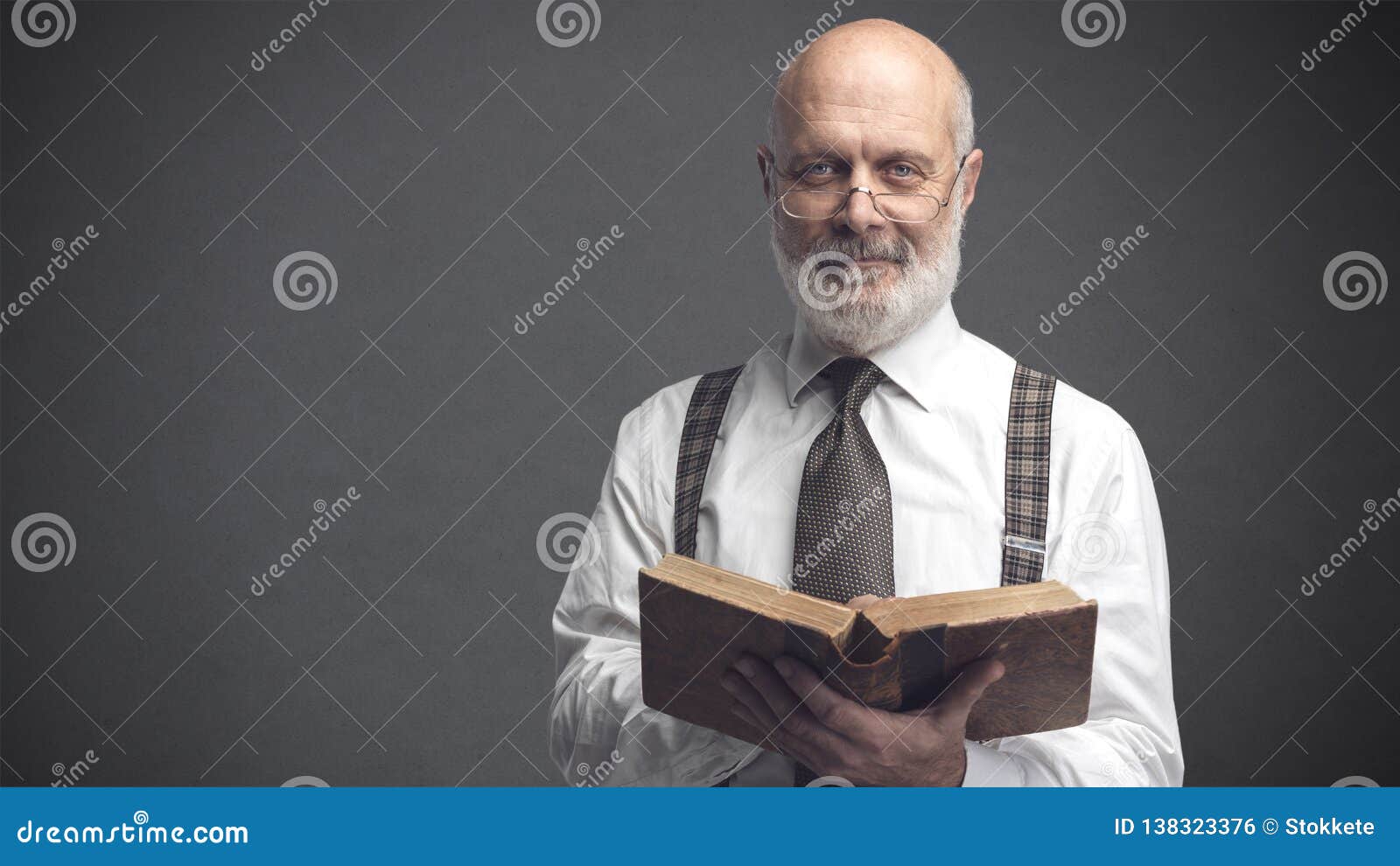 Academic Professor Smiling and Reading a Book Stock Photo - Image of ...