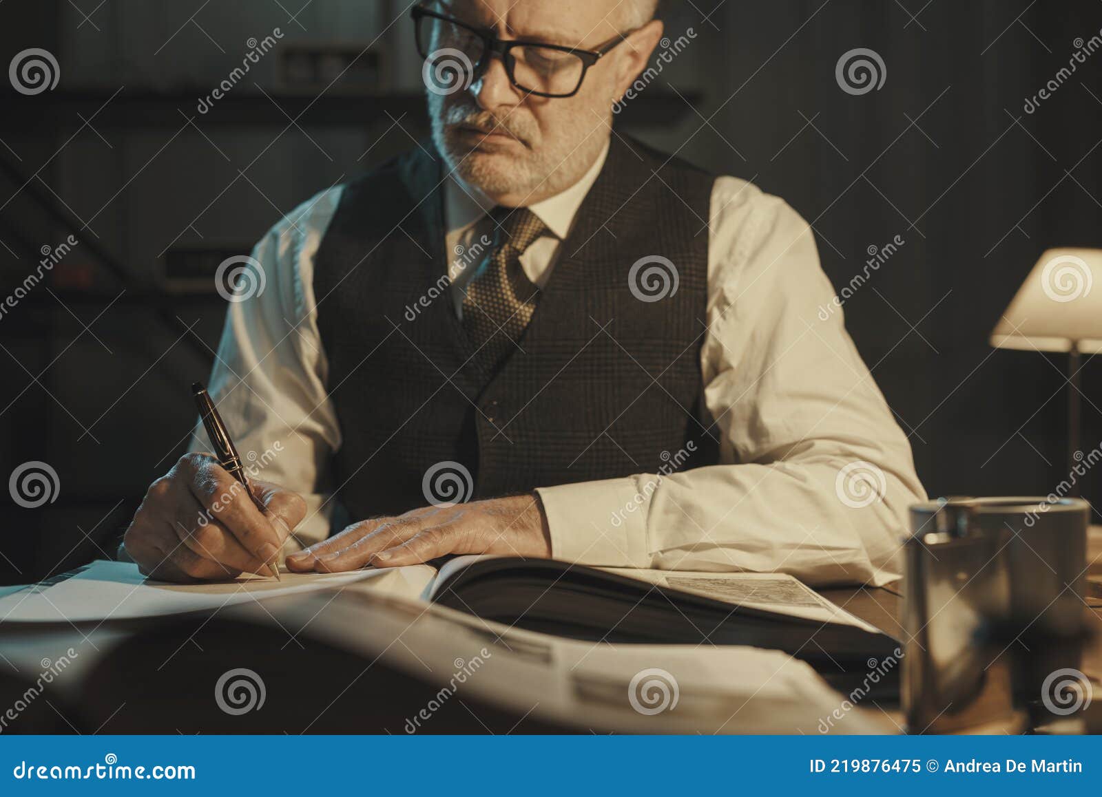 Academic Professor Writing Down Notes and Reading a Book Stock Image ...