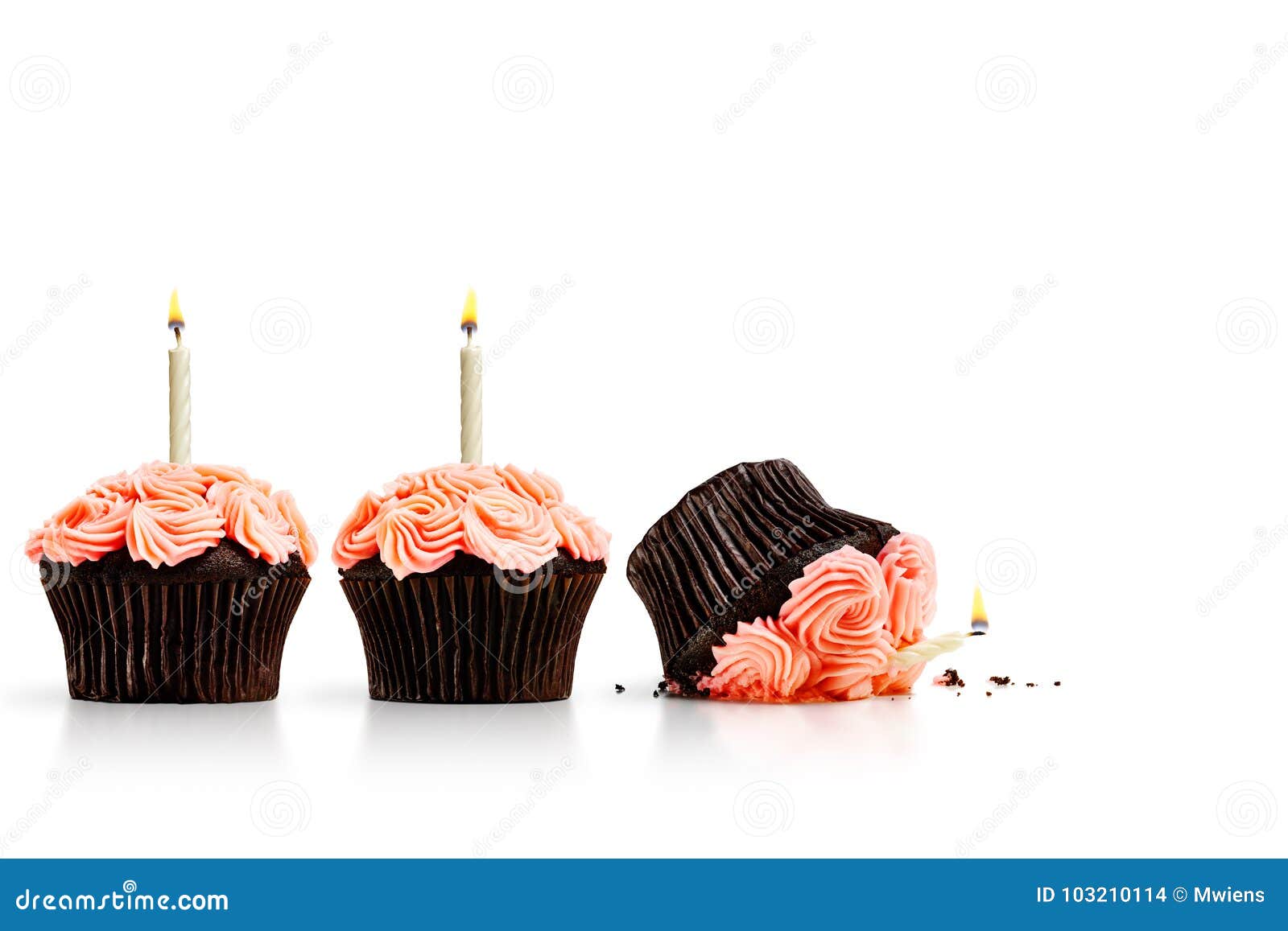 Smashed Cupcake in Row of Pink Cupcakes with Candles on White Stock ...