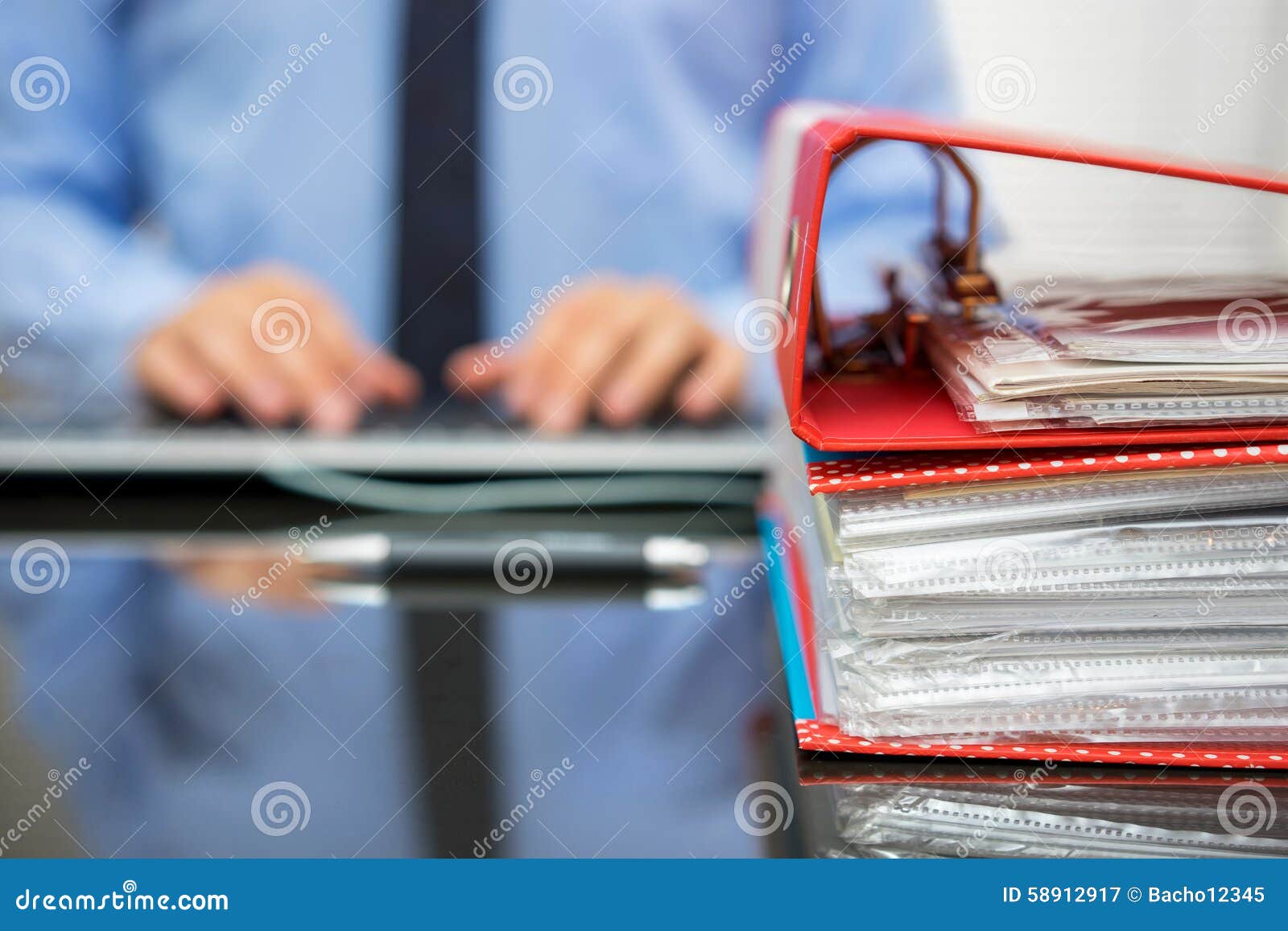 Accountant with Stack of Invoices is Inserting Data into Compute Stock ...