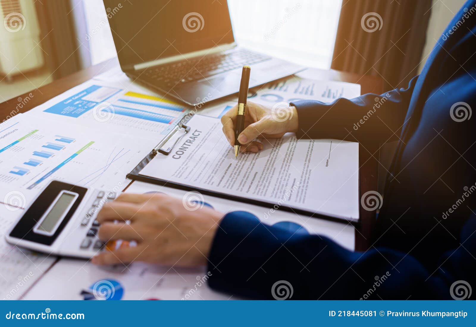 Accountant Women Calculate and Writing Contract Documents on the Table ...