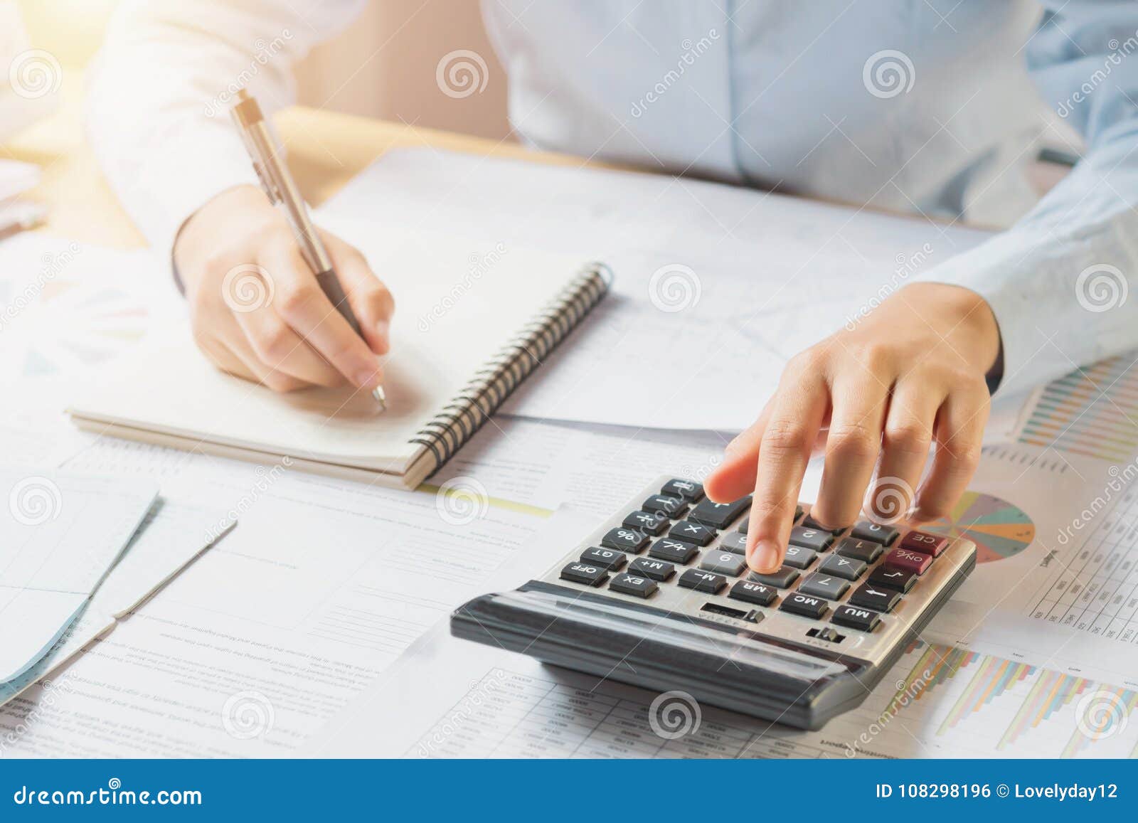 Accountant working on desk stock photo. Image of asset - 108298196