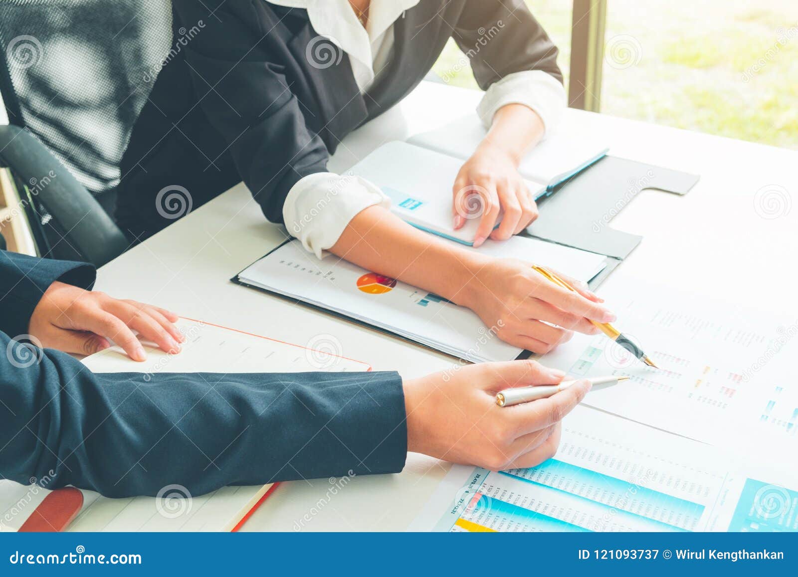 Accounting Officer Team Working and Analysis Data Chart in Office ...