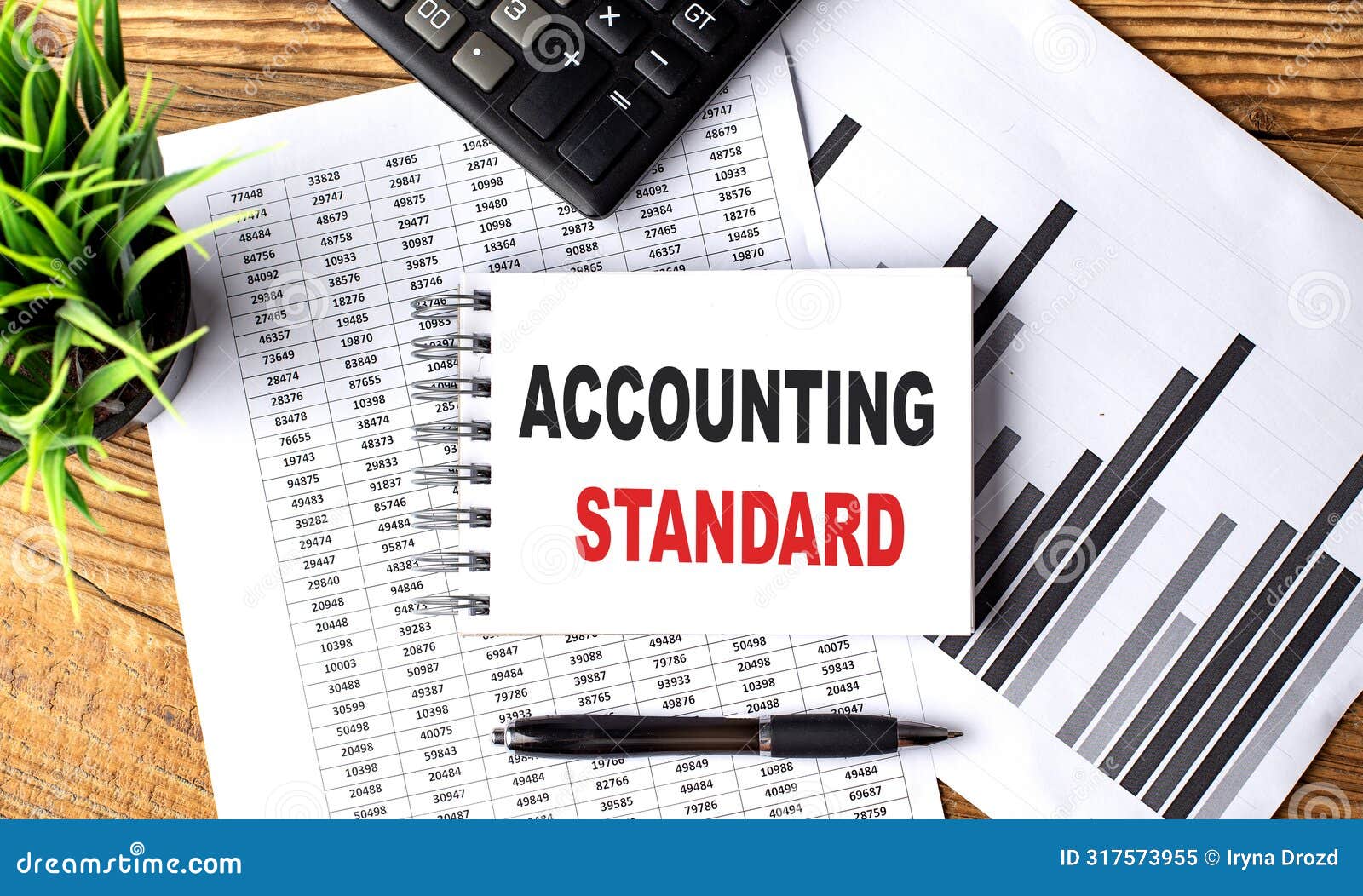 ACCOUNTING STANDARD Text on Notebook on Chart with Calculator and Pen ...