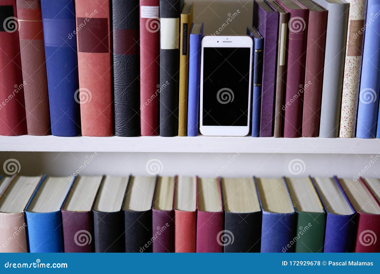 Accurate Bookcase with Mobile Phone Stock Photo - Image of apple ...