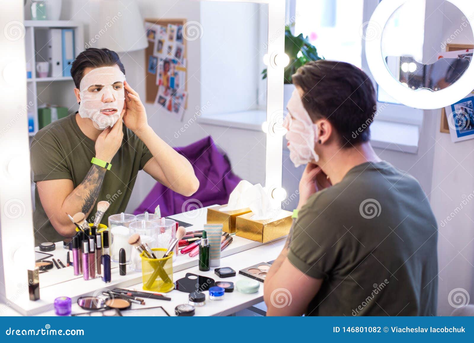 Accurate Man Correcting His Smoothing Face Mask while Getting Ready ...