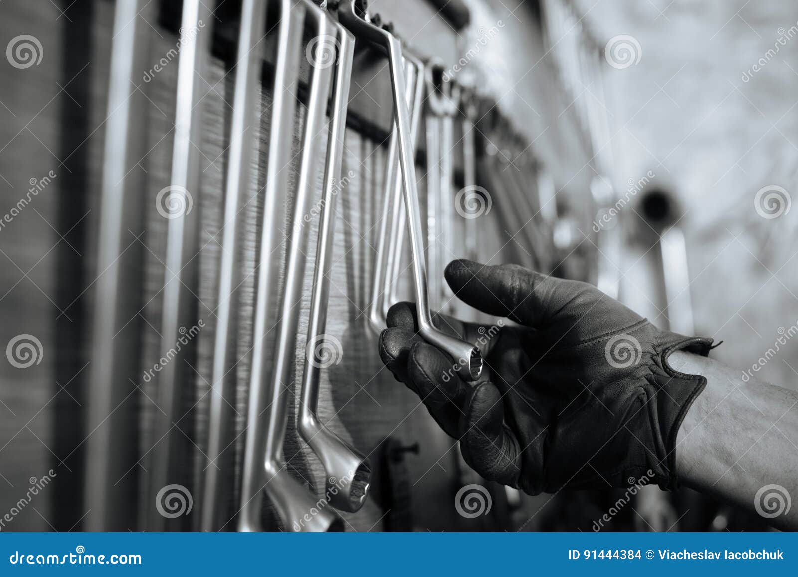 Accurate Mechanic Looking for the Right Size of a Tool Stock Photo ...