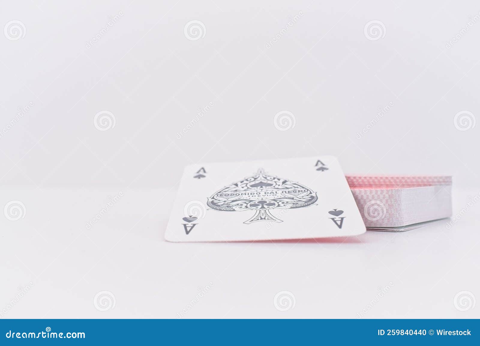 Ace Card and Playing Cards on a White Table Surface Stock Photo - Image ...