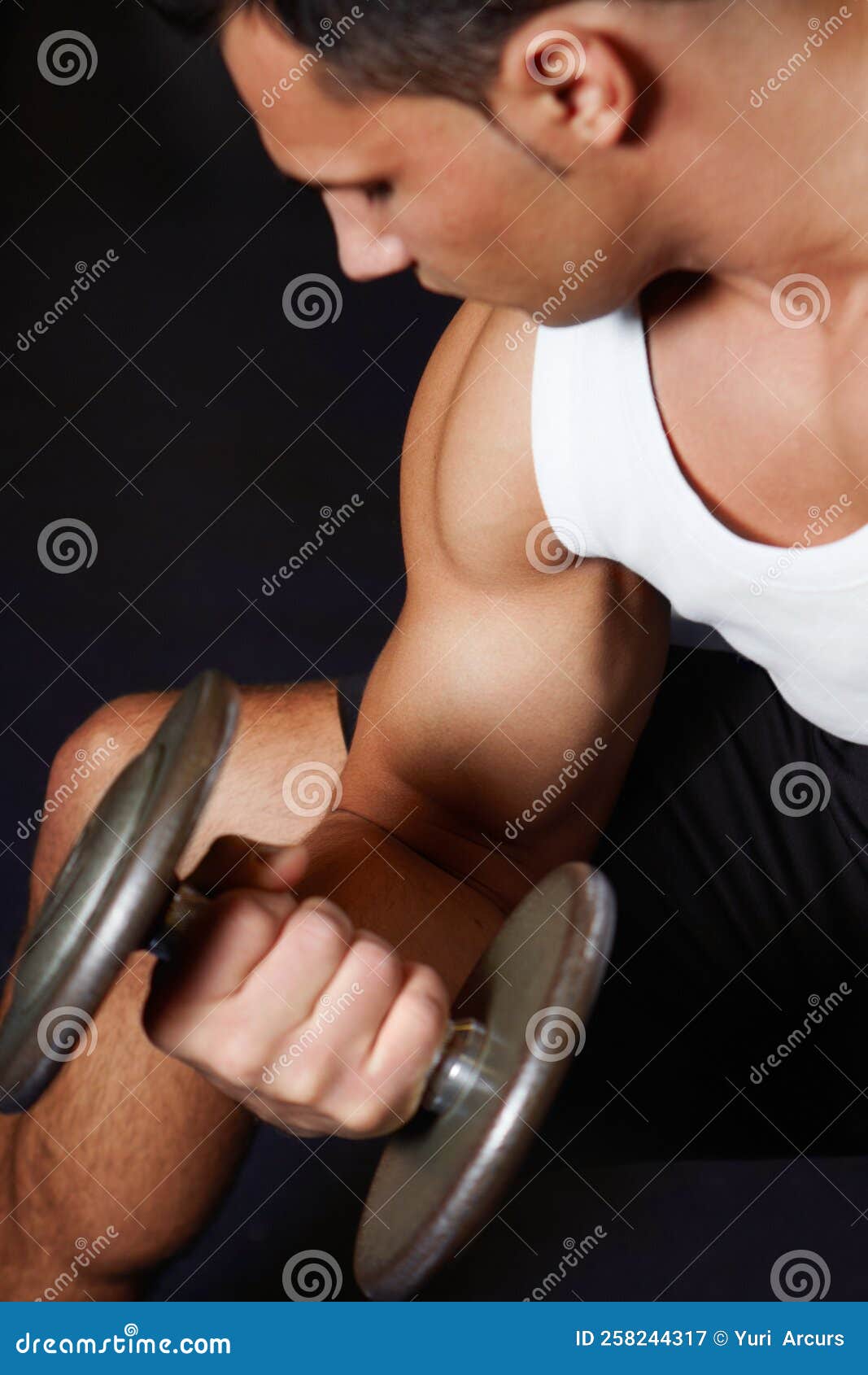 Acing this Workout. a Handsome Young Man Lifting Weights. Stock Image ...