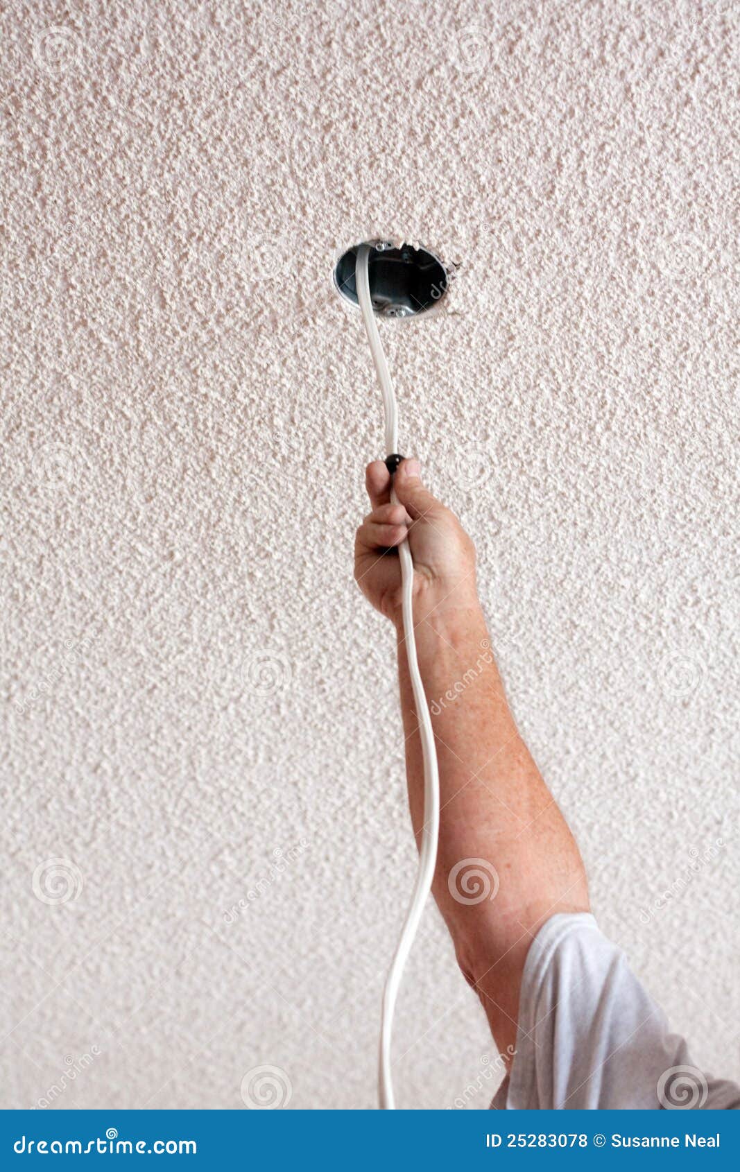 Pulling An Electrical Cable Out Of A Wall Socket To Save Energy Royalty ...