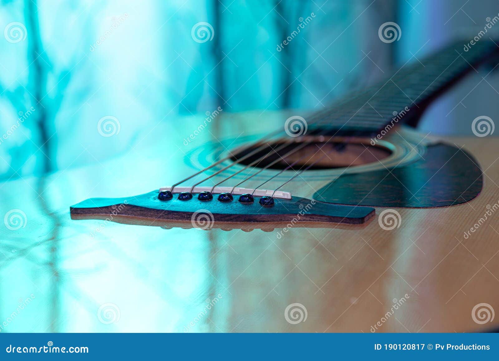 Acoustic Guitar on a Beautiful Colored Background. the Concept of ...