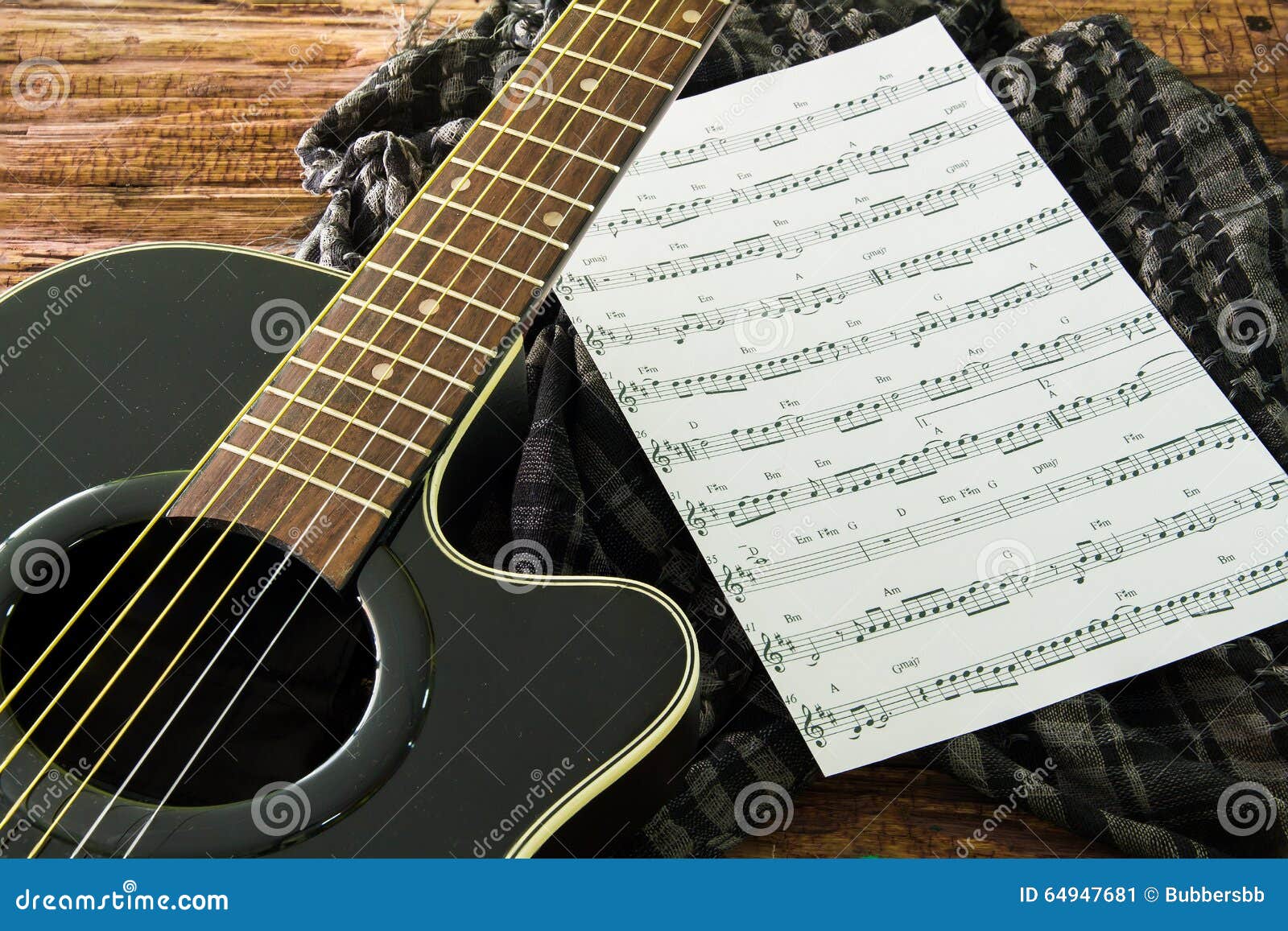Acoustic Guitar and Sheet Musical Notes on the Table. Stock Image ...