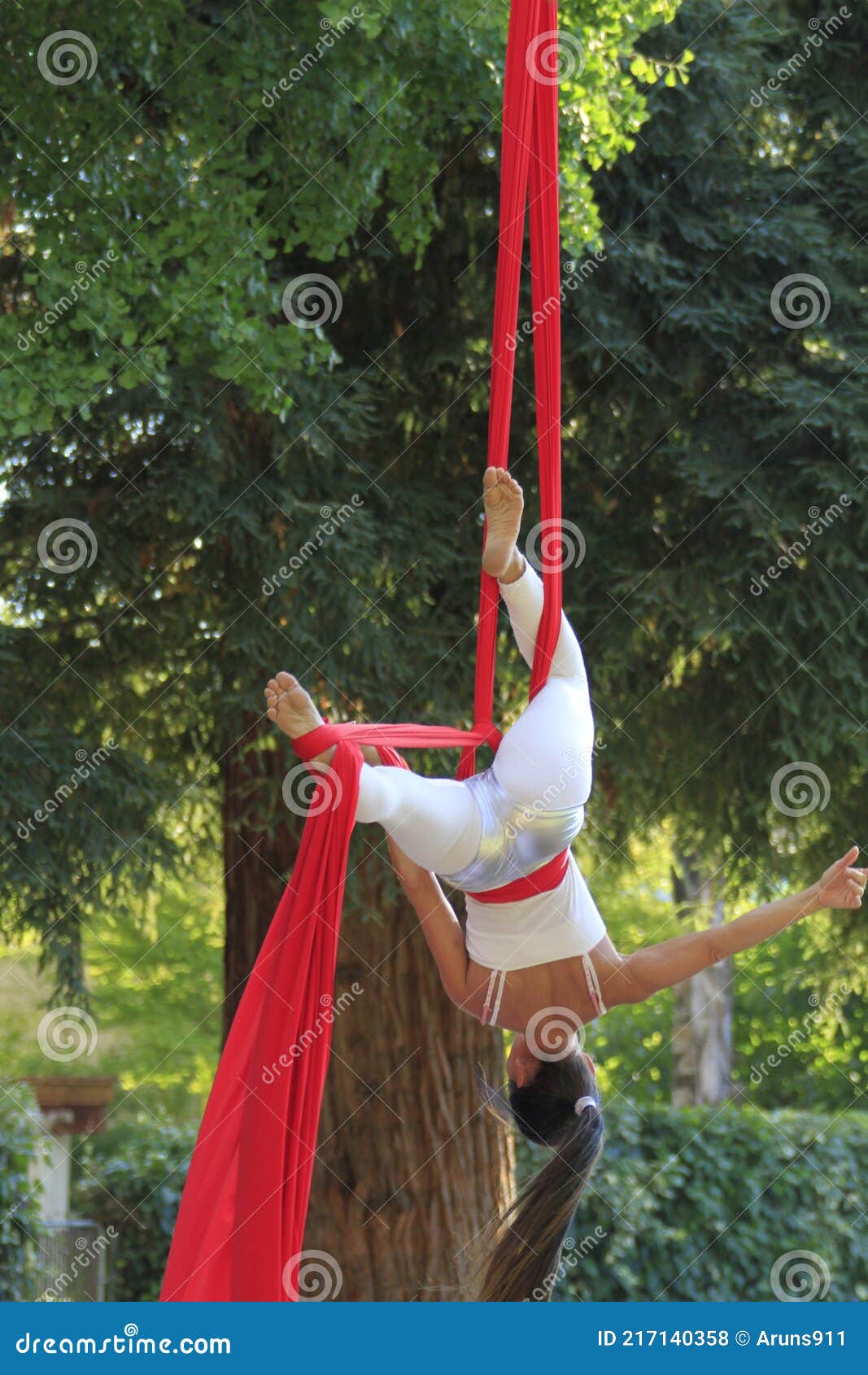 Acrobat Doing Moves in a Park Stock Photo - Image of silk, outdoors ...